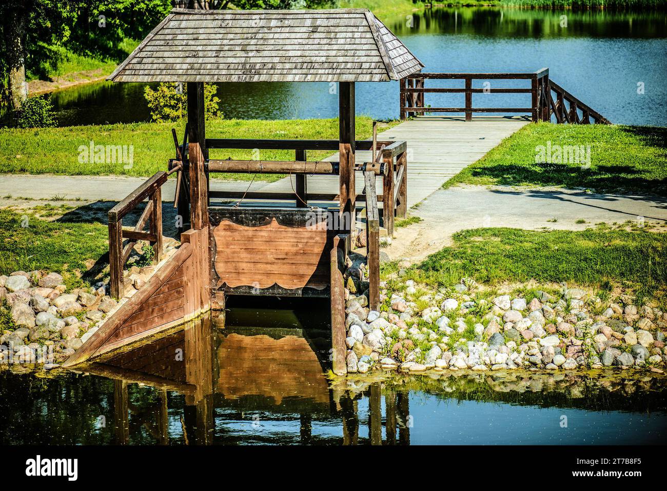 Wooden sluice on the summer river Stock Photo - Alamy