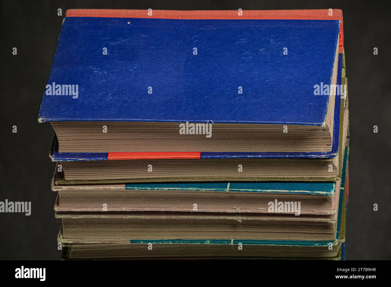 Stack of books in different colors Stock Photo - Alamy