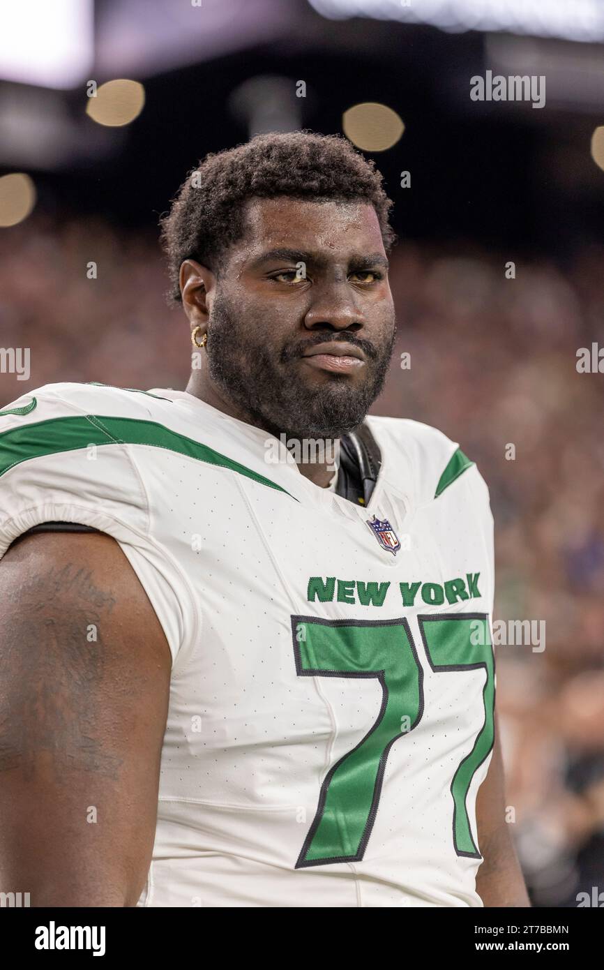 New York Jets tackle Mekhi Becton (77) stands for the National Anthem ...