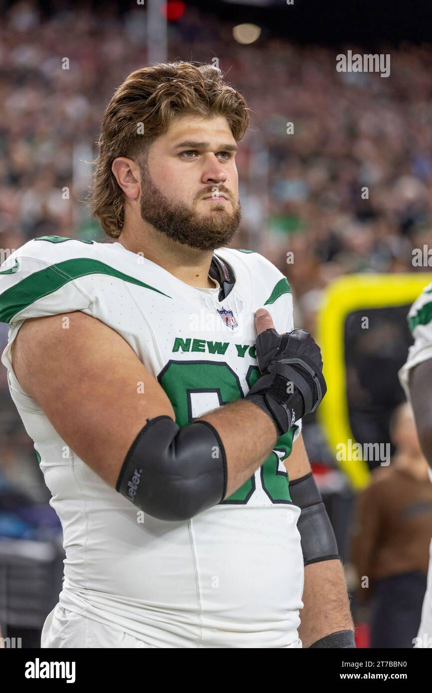 New York Jets center Joe Tippmann (66) stands for the National Anthem ...