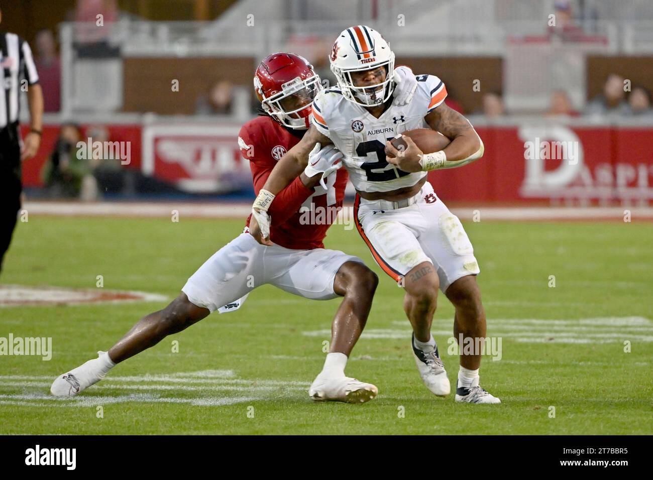 Auburn running back Jarquez Hunter (27) is tackled by Arkansas ...