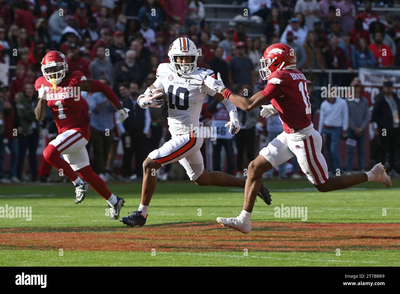 Auburn wide receiver Caleb Burton III (10) tries to get past Arkansas ...