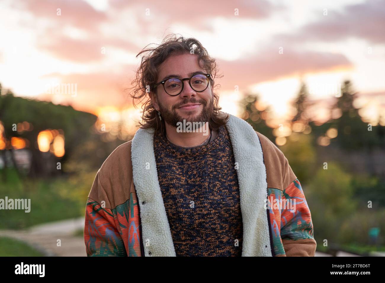 portrait of cheerful trans woman with glasses looking c camera on ...