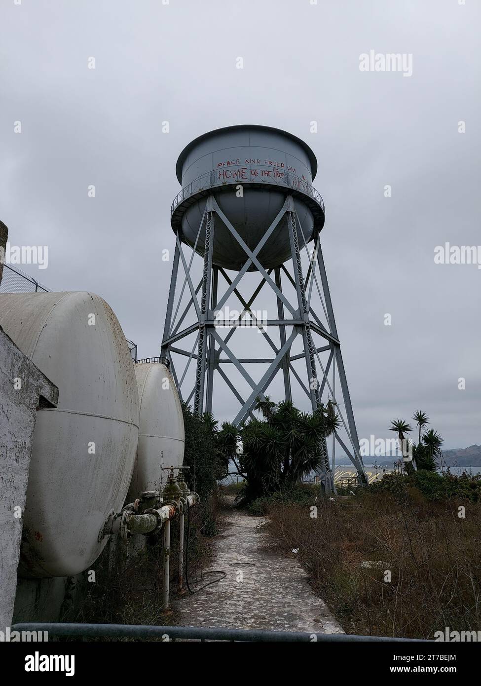 Aerial view of two water towers situated on a beach shoreline ...