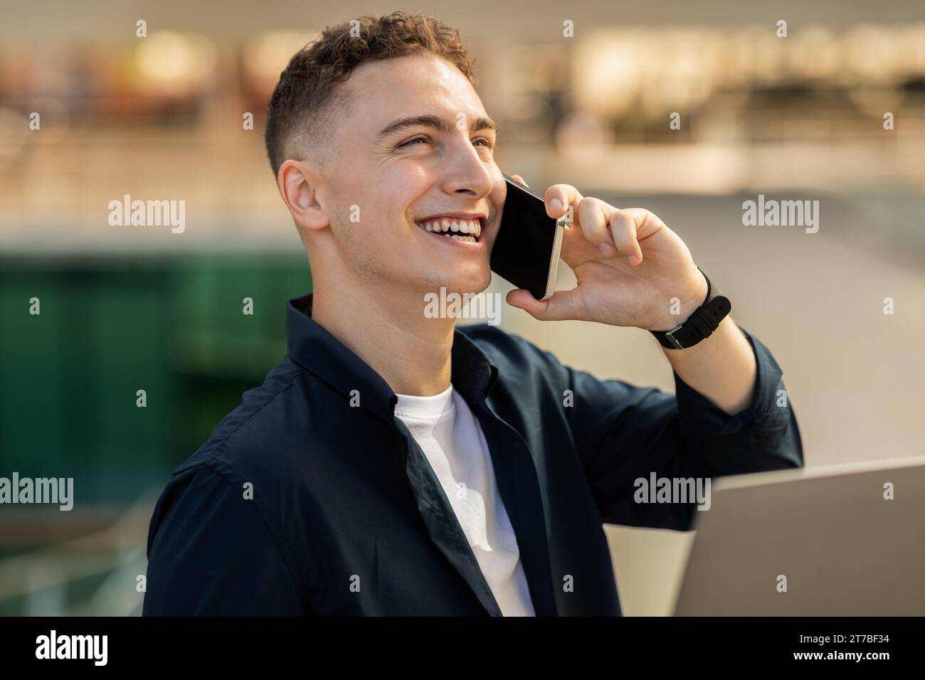 Inspired smiling millennial caucasian guy enjoy calling by phone, good ...