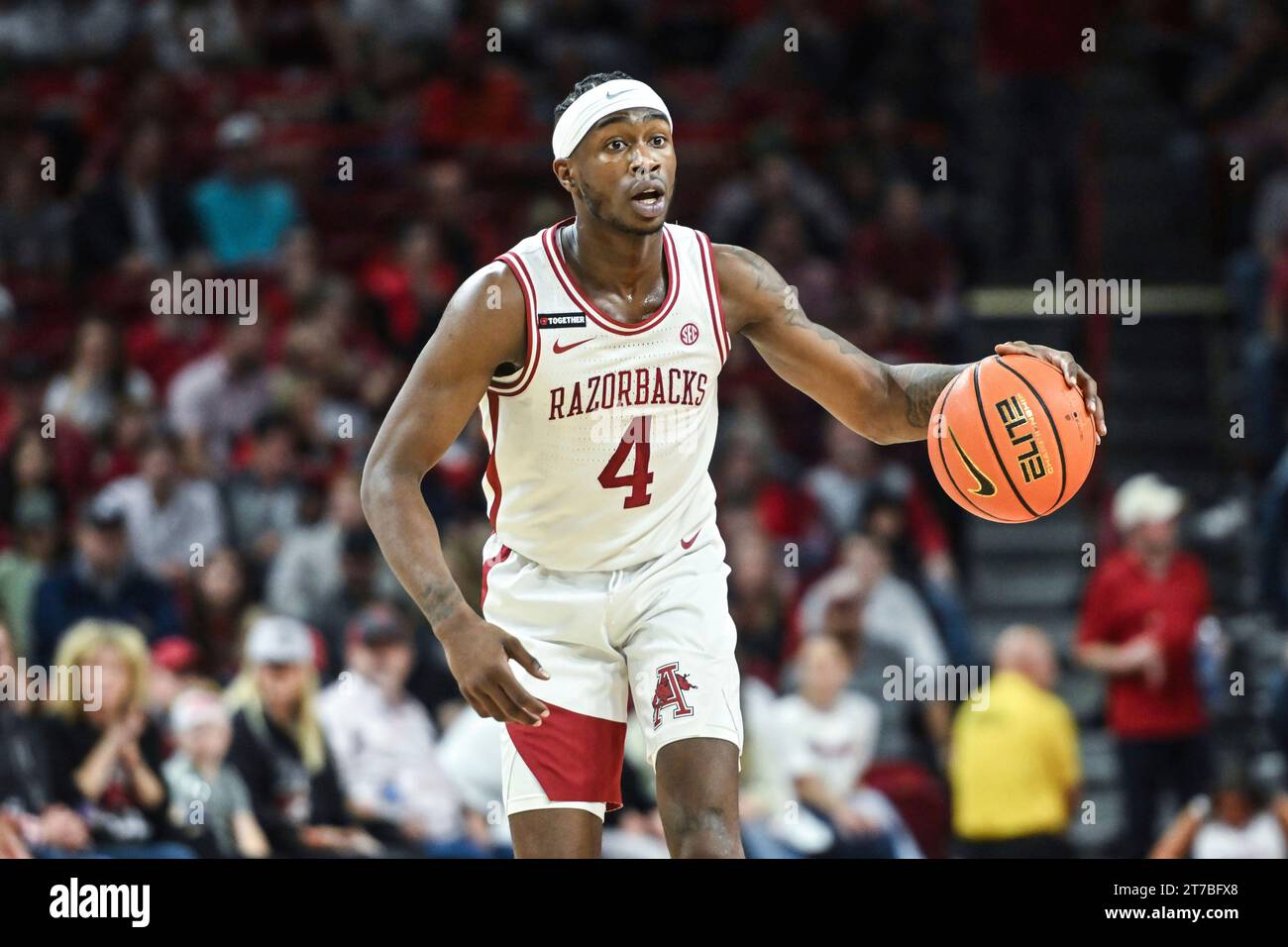 Arkansas guard Davonte Davis (4) runs a play against Gardner-Webb during an NCAA college ...