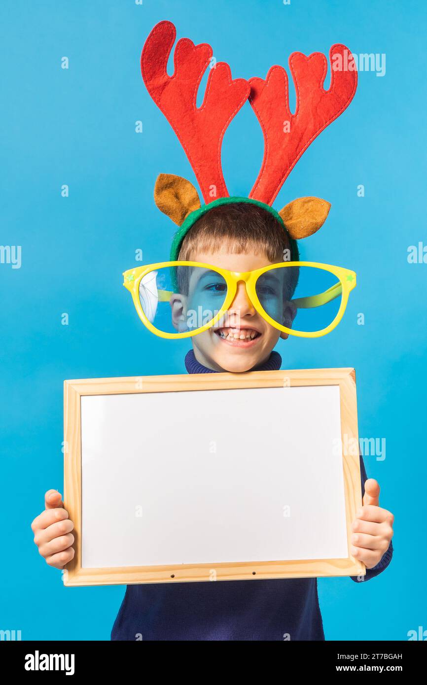 Cheerful little boy generation alpha in big glasses express a surprised ...