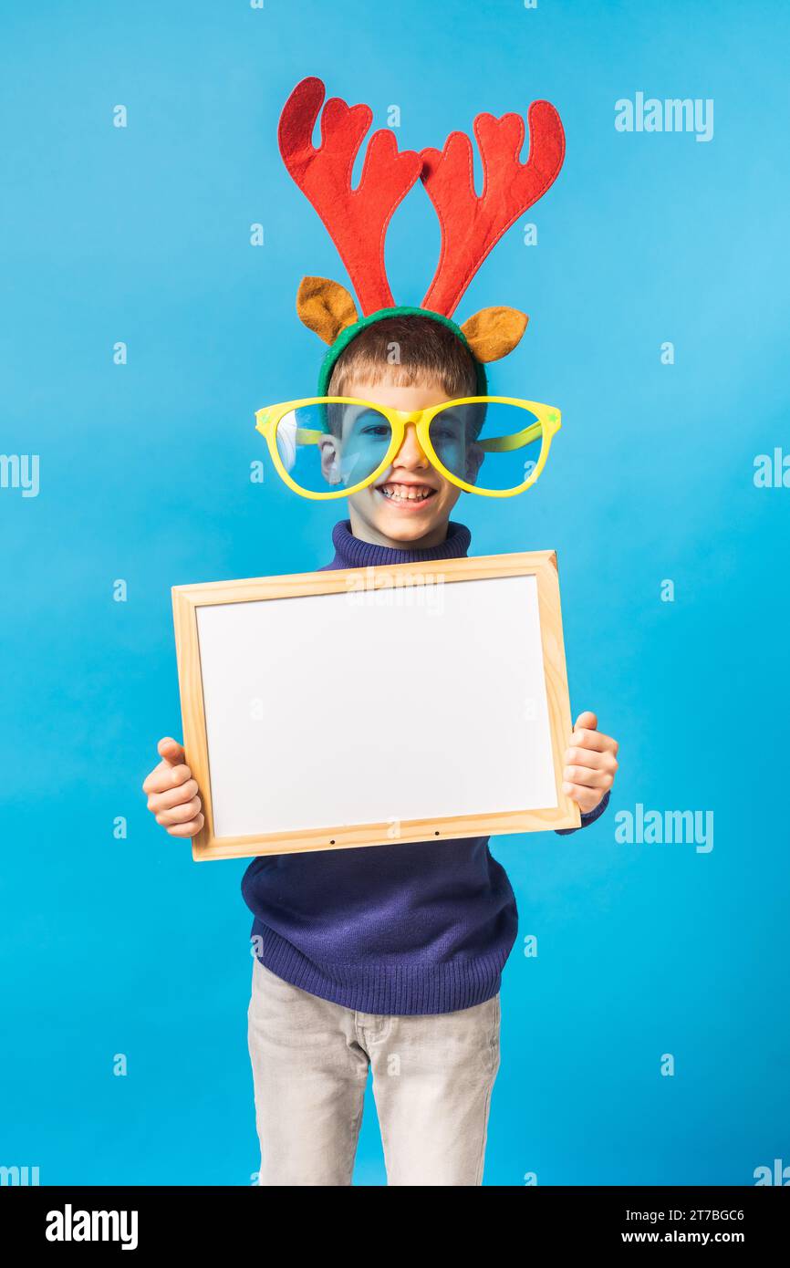 Cheerful little boy generation alpha in big glasses express a surprised ...
