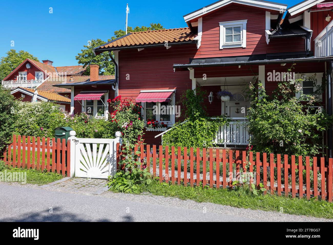 Traditional wooden Swedish houses on the island of Vaxholmen in the ...