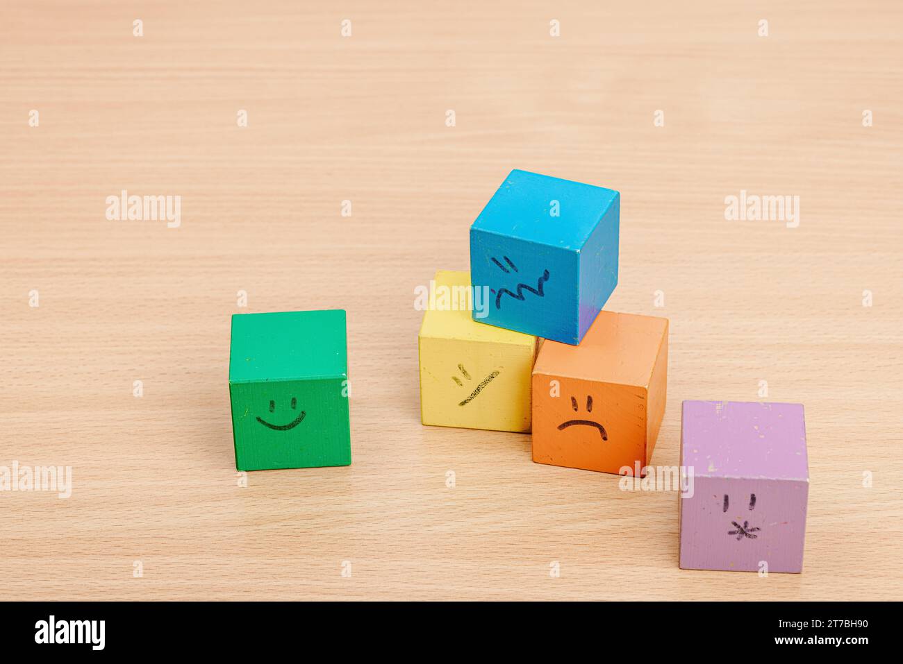 World mental health day. wooden cubes with different emotions. Feedback ...