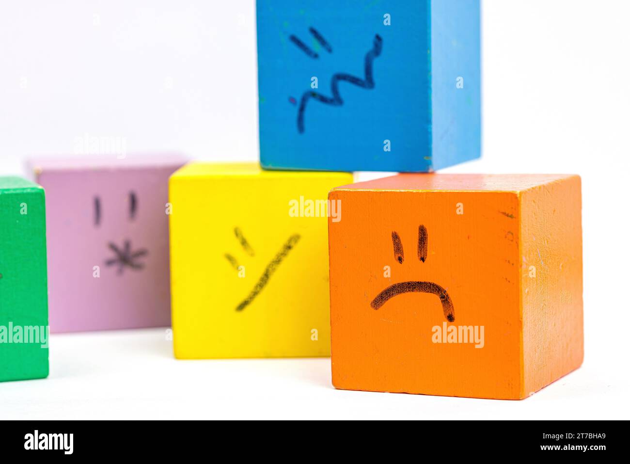 World mental health day. wooden cubes with different emotions. Feedback ...