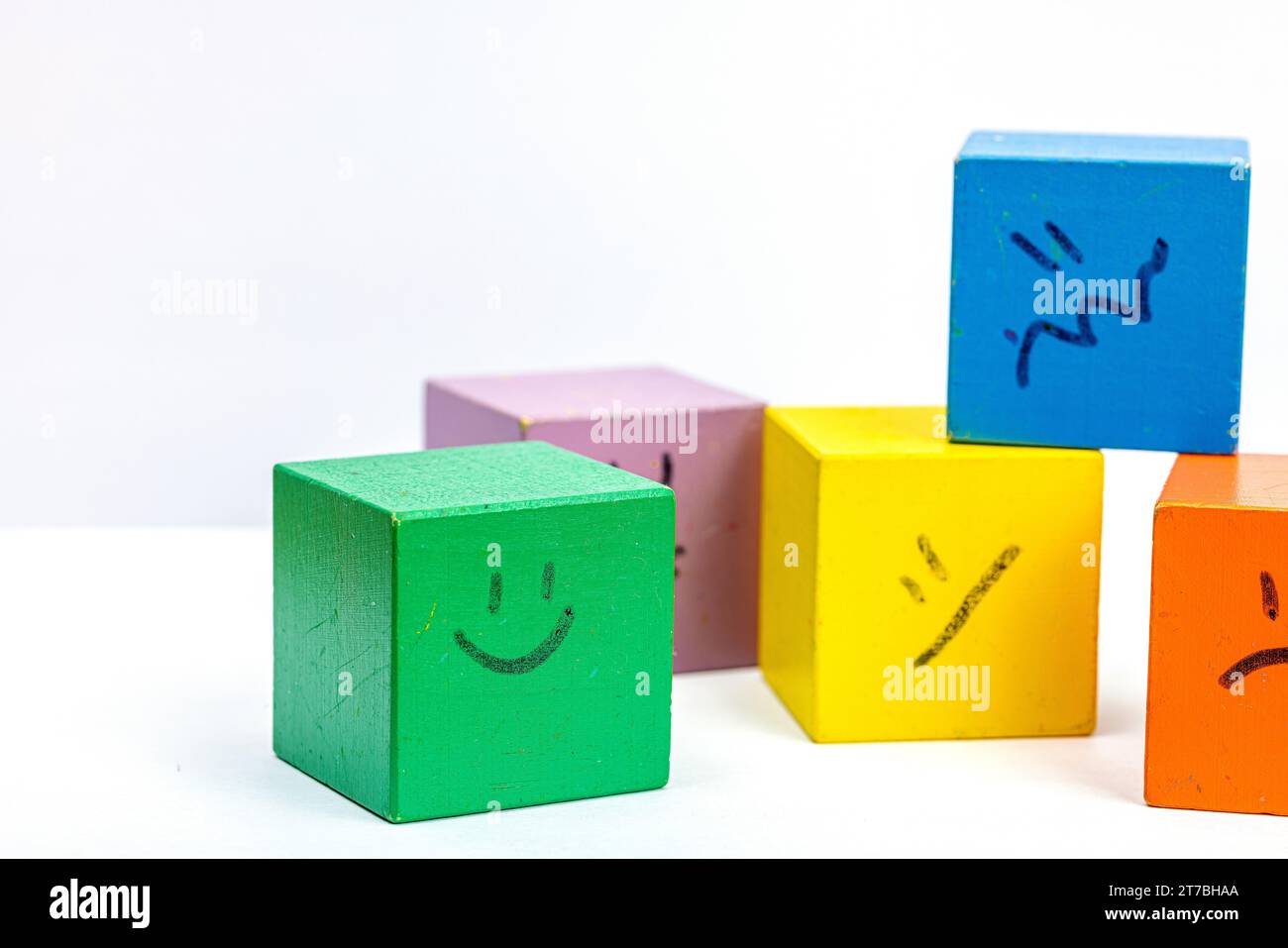 World mental health day. wooden cubes with different emotions. Feedback ...