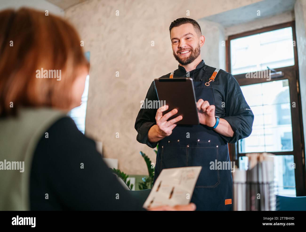 Female caucasian male waiter hi-res stock photography and images - Alamy