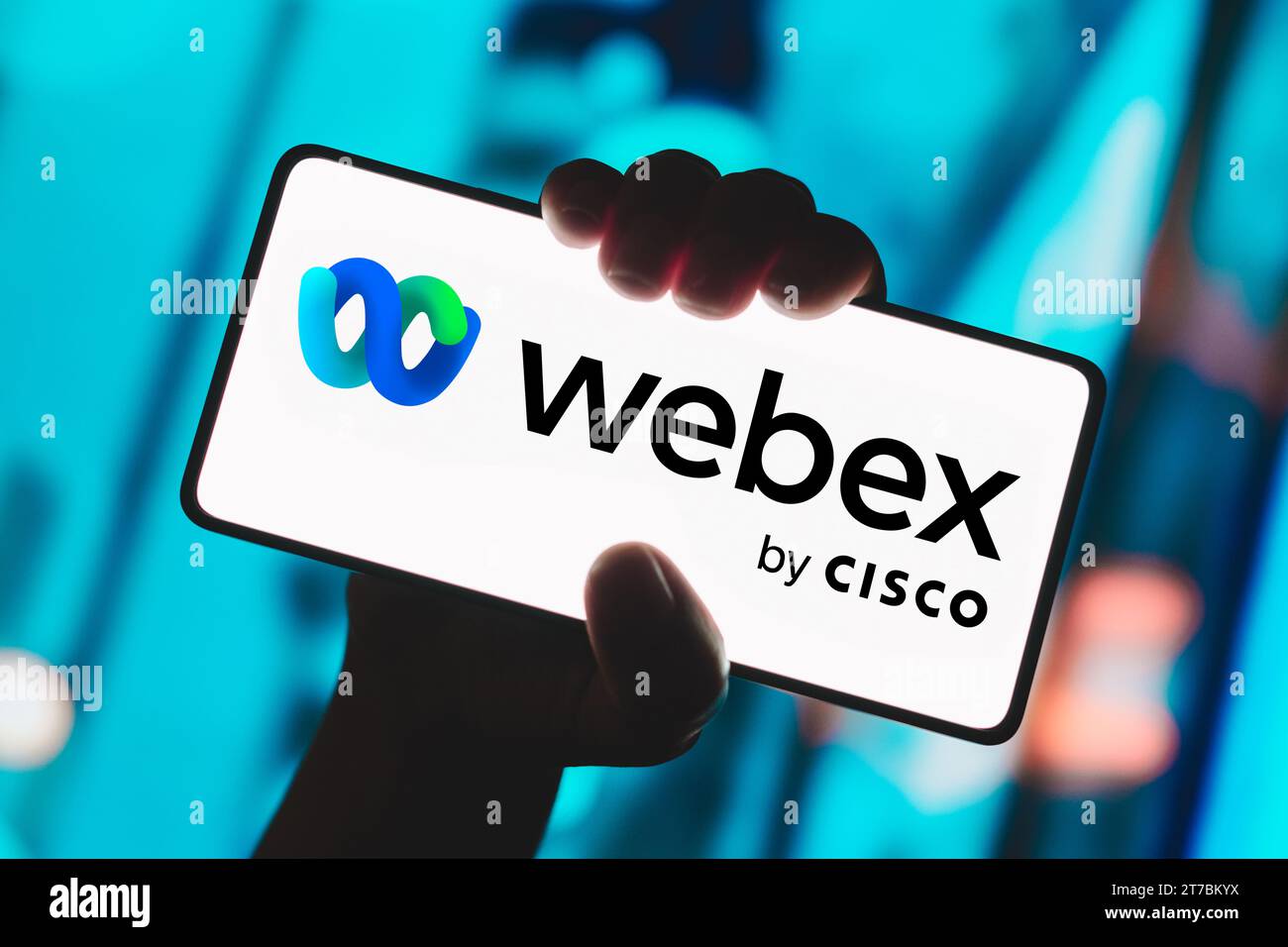 In this photo illustration, the Cisco Webex logo is displayed on a smartphone screen Stock Photo ...