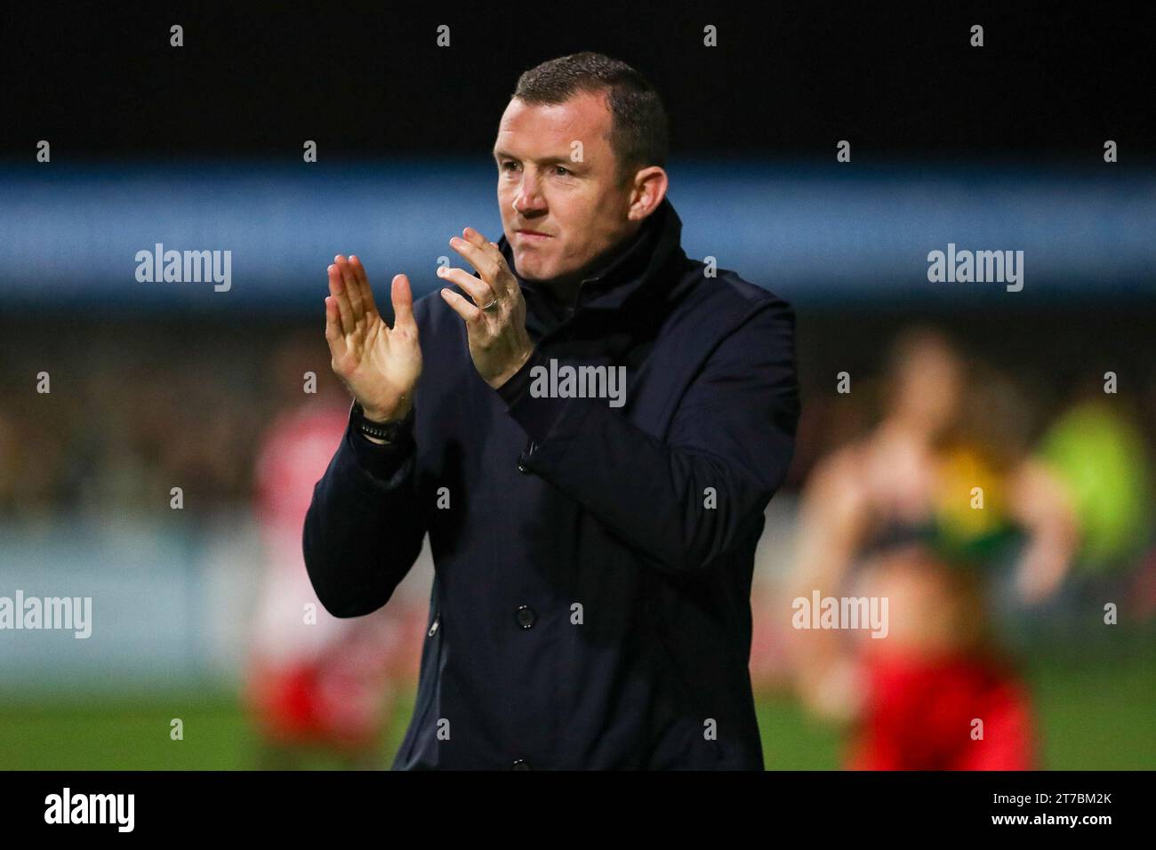 Horsham, UK. 14th Nov, 2023. Barnsley Manager Neill Collins applauds ...