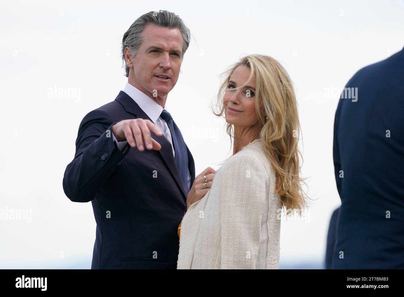 California Gov. Gavin Newsom and his wife Jennifer wait to greet ...