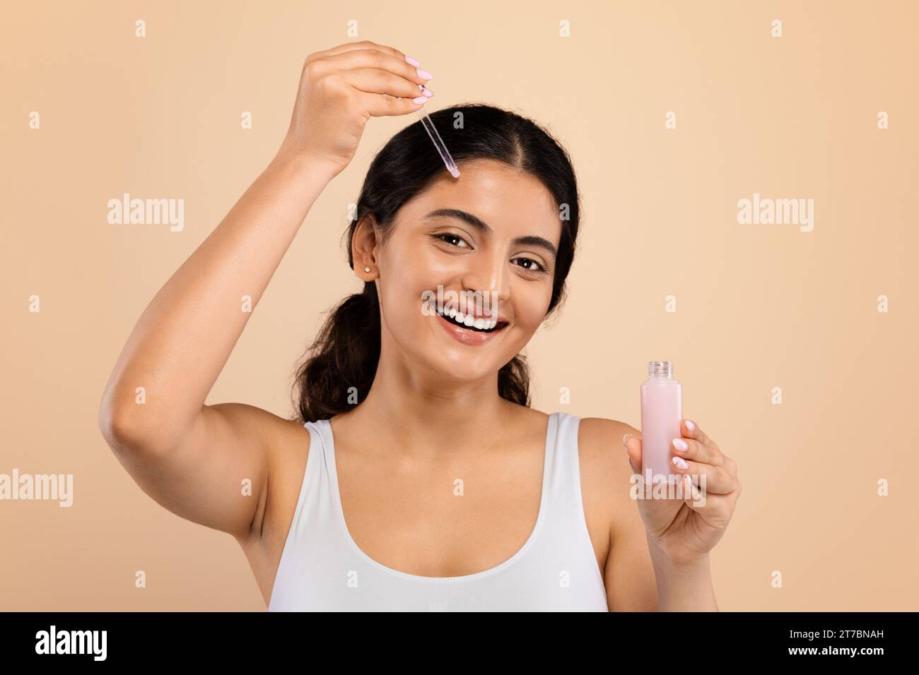 Skincare Cosmetics. Beautiful Indian Lady Holding Open Bottle With ...