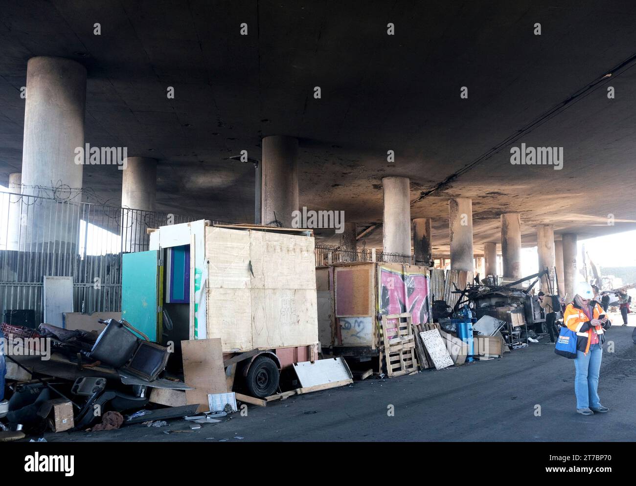 Part of a burned homeless encampment is shown as crews continue to ...