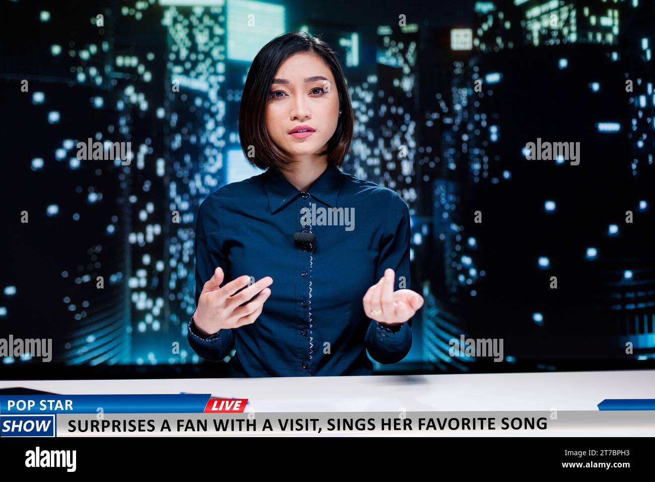 Asian presenter covers media segment, presenting news about pop star ...