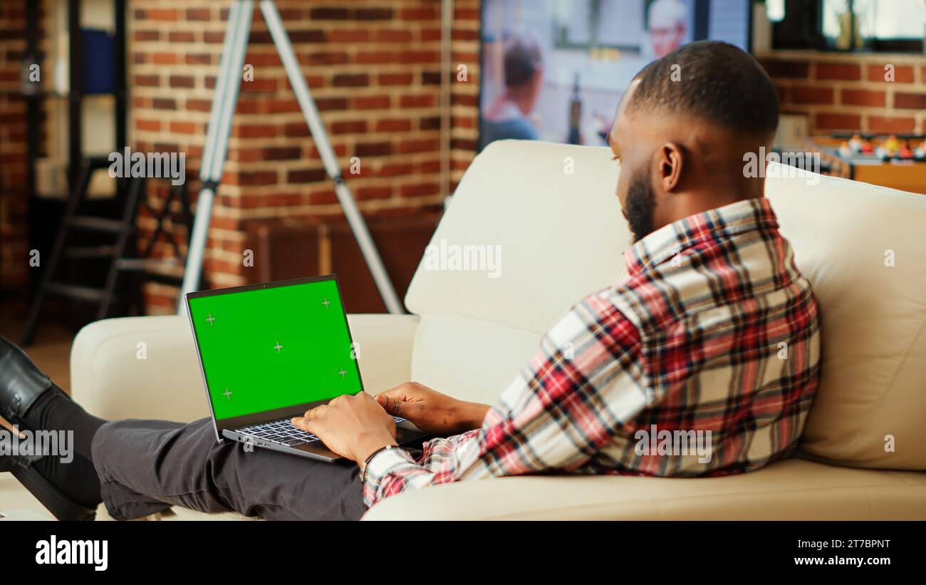 Focused remote freelancer working from home, typing data on chroma key ...