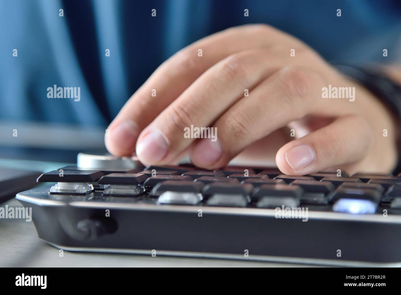 Designer working with wheel manipulator keyboard in home office ...