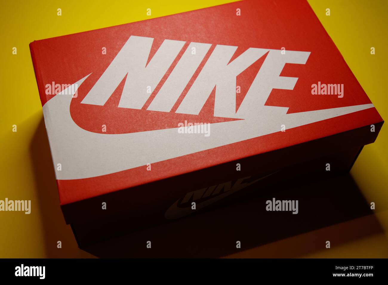 an original bright red vintage style "Nike" carboard shoe box, with ...