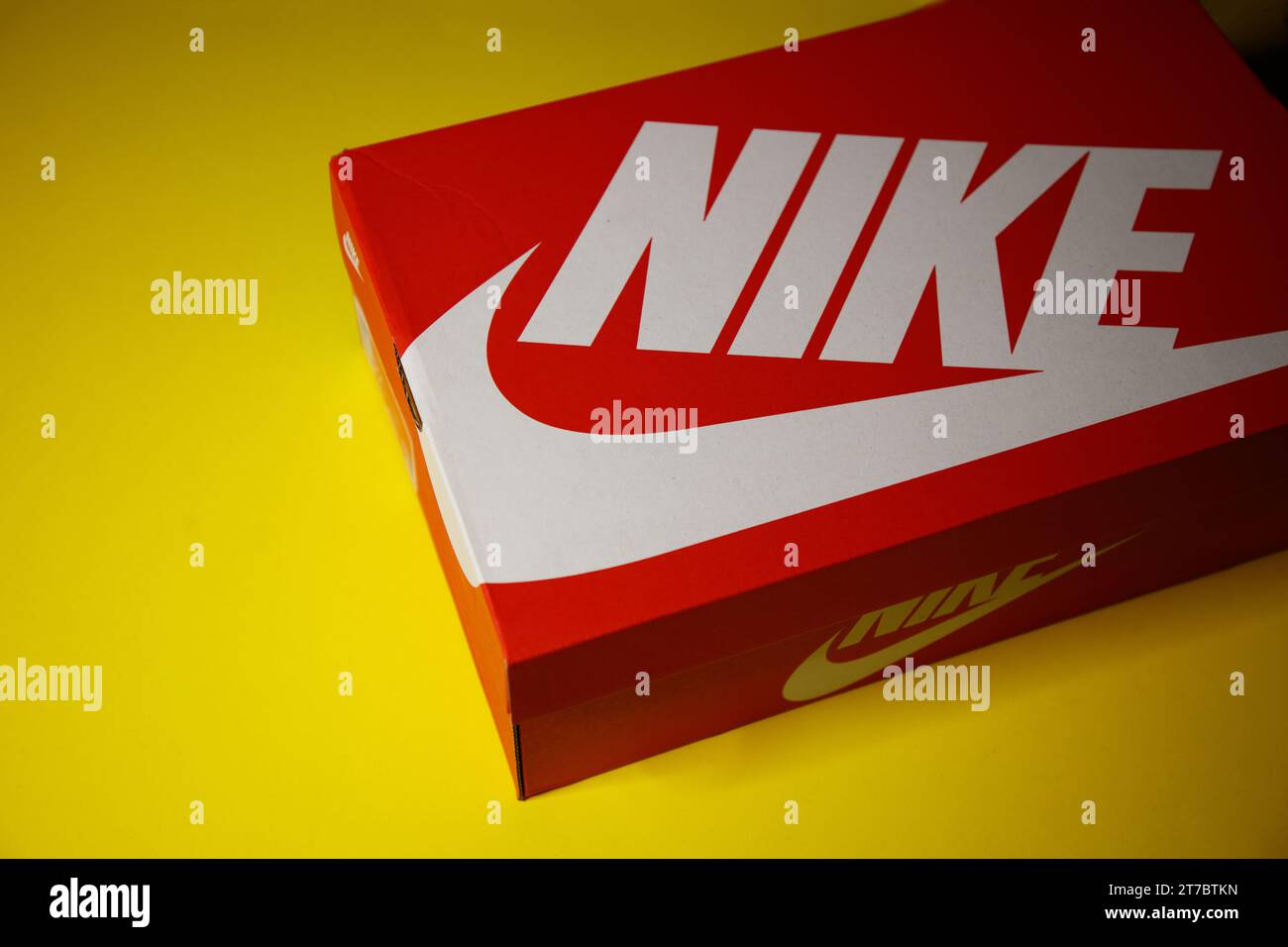 an original bright red vintage style "Nike" carboard shoe box, with ...