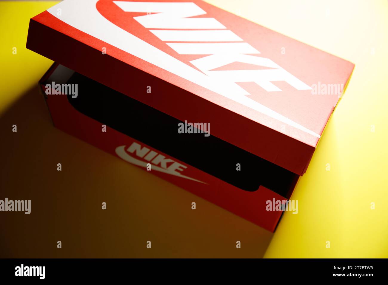 an original bright red vintage style "Nike" carboard shoe box, with ...