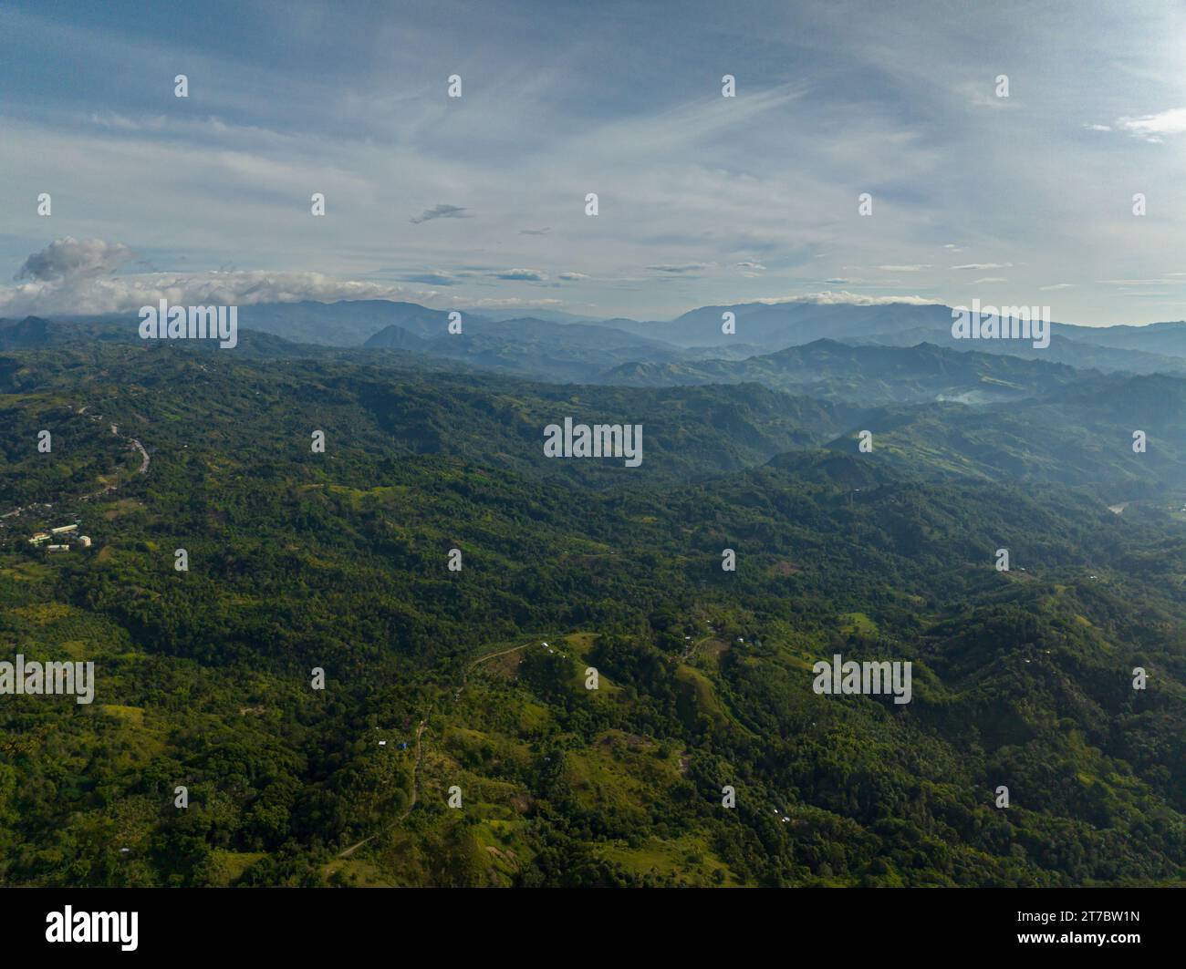 Mountain province with green forest. Blue sky and clouds. Mindanao ...