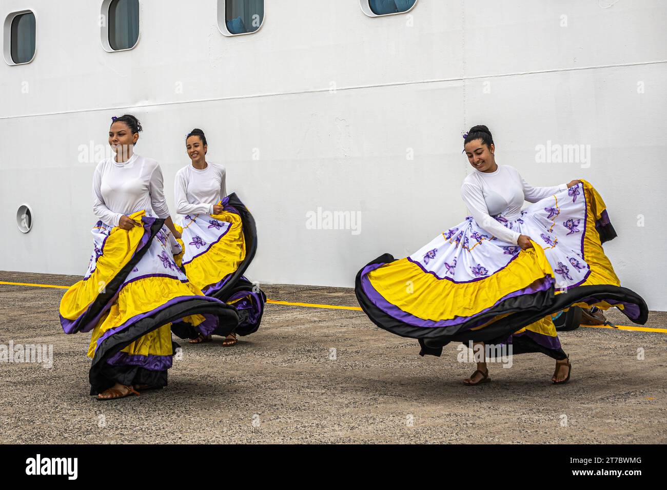 Costa Rica Puntarenas - July 22, 2023: Closeup of 3 female folk dancers ...