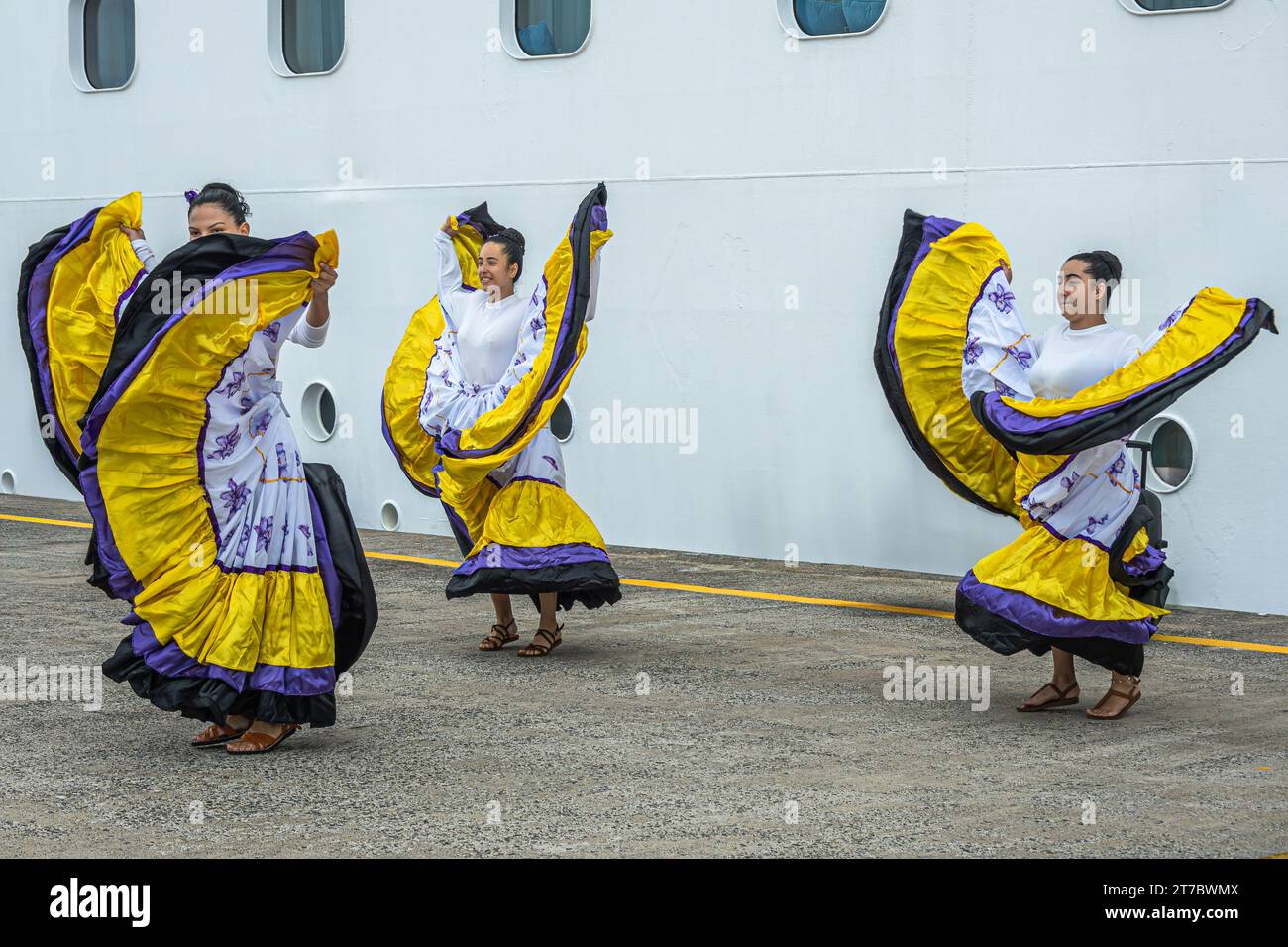 Costa Rica Puntarenas - July 22, 2023: Closeup of 3 female folk dancers ...