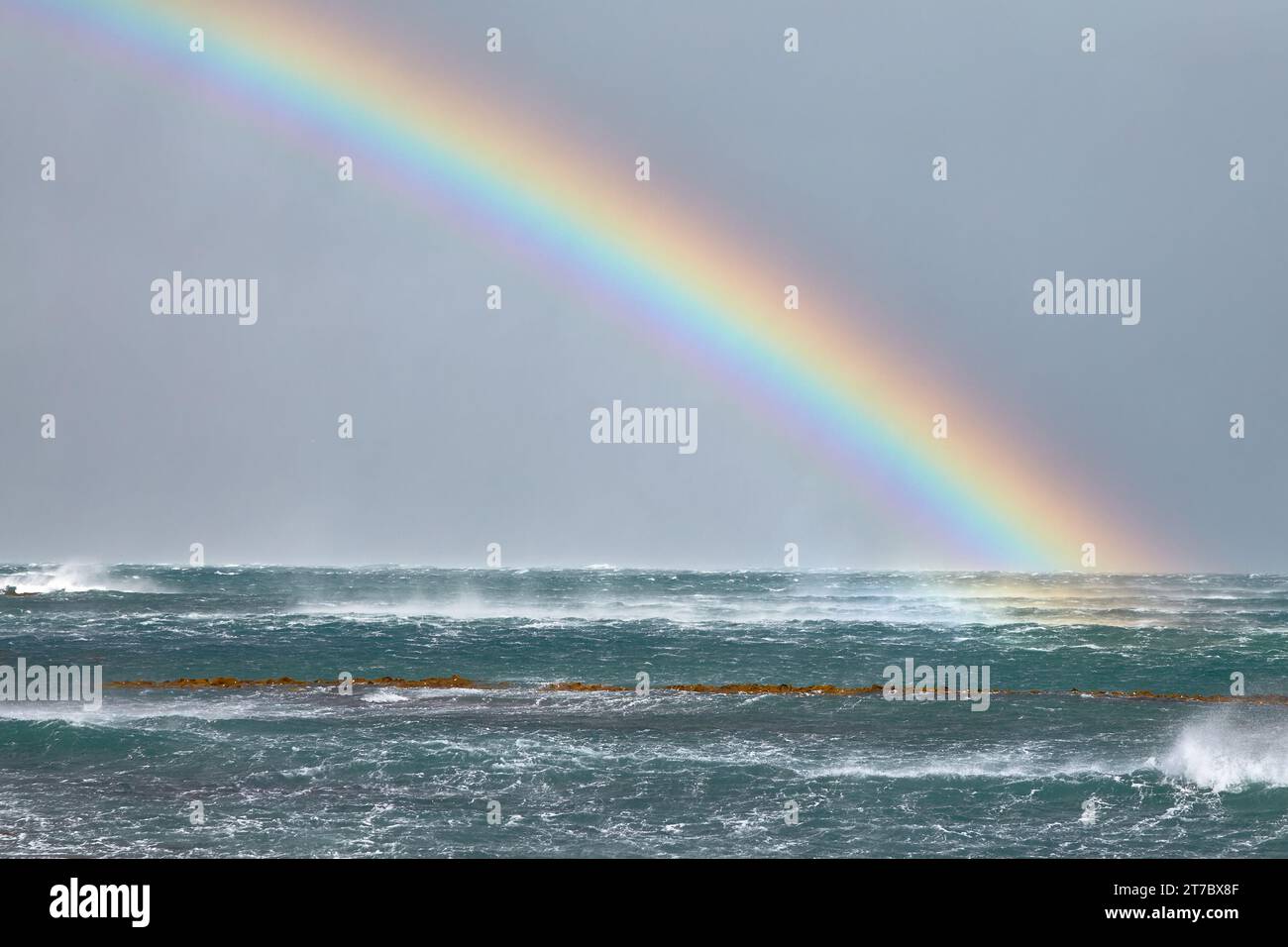 Rainbow over sea Stock Photo - Alamy