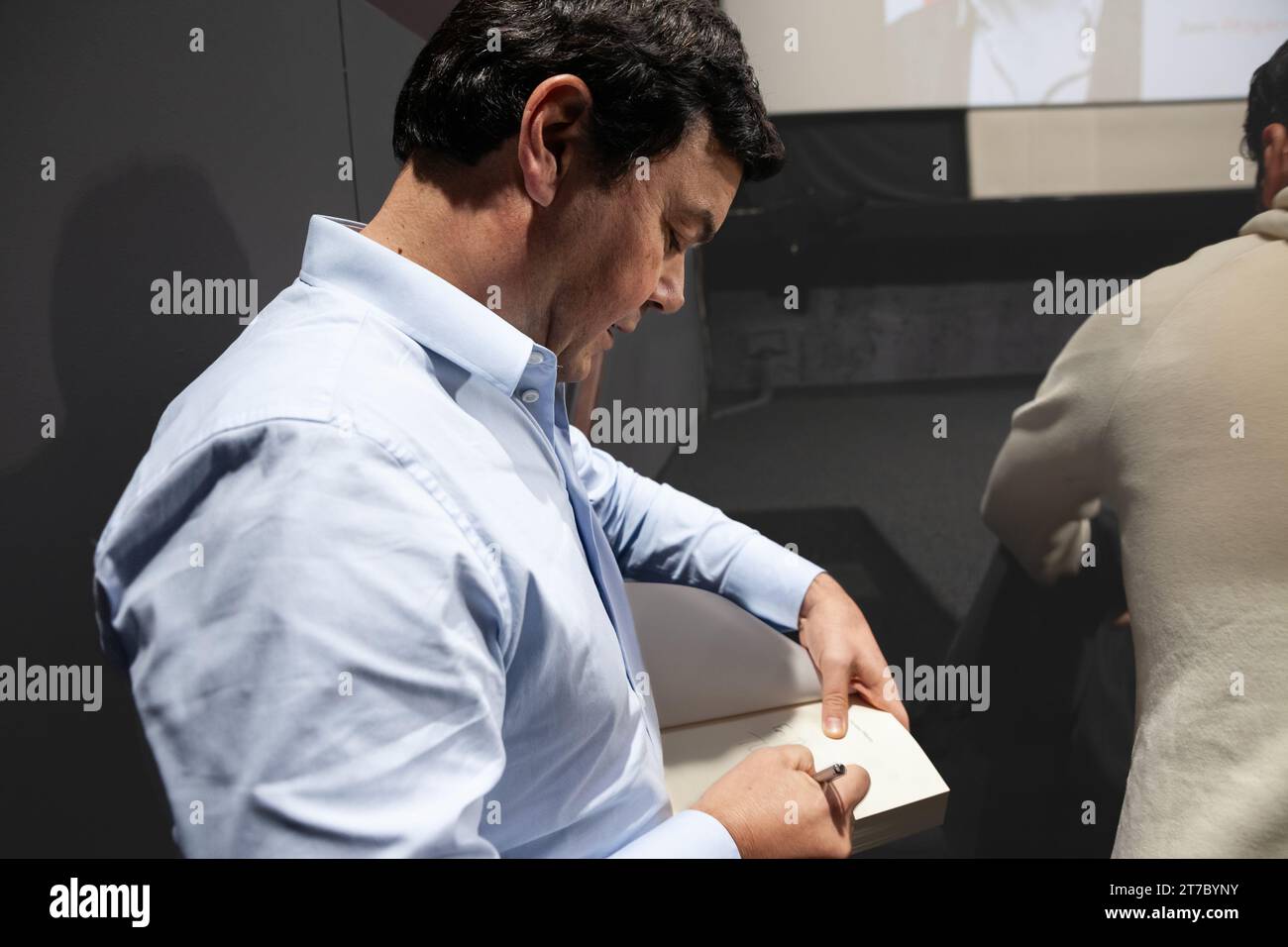 Picture of a portrait of Thomas Piketty posing before a conference in ...