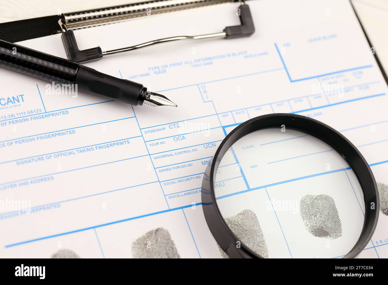 Fingerprints card police form on A4 tablet lies on office table with ...