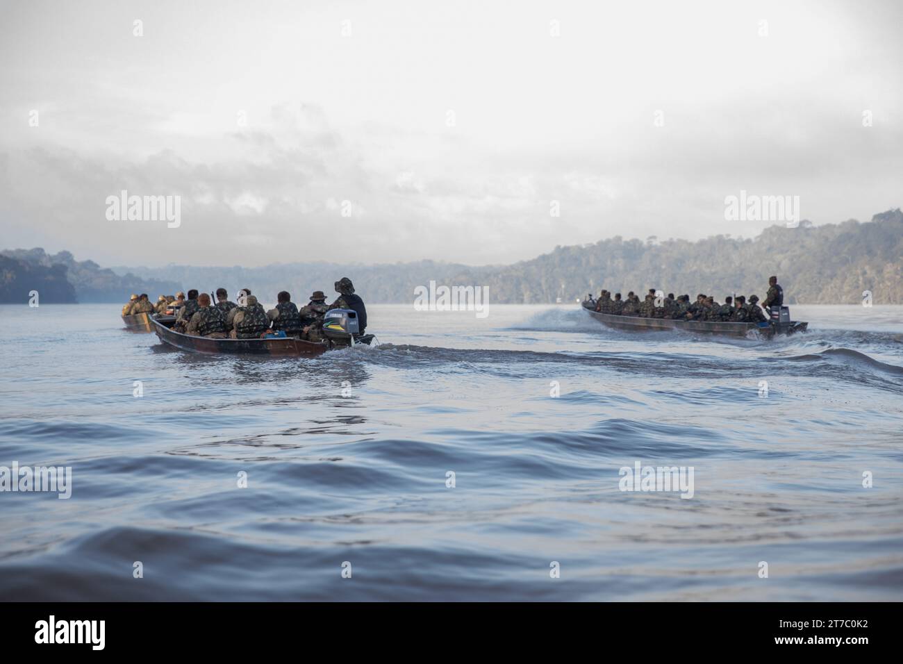 U.S. and Brazilian Army Soldiers move south along the Oyapock River ...