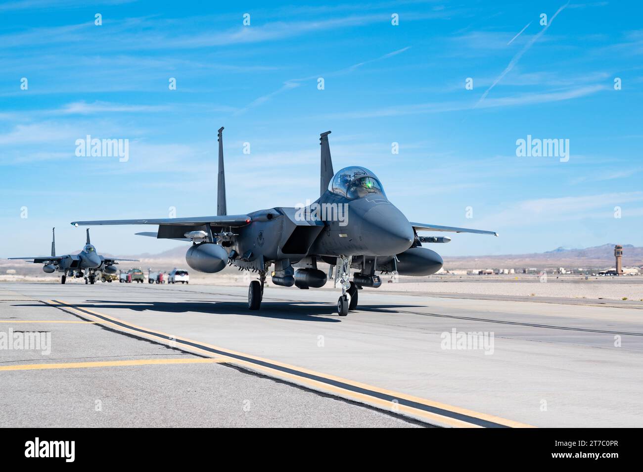 Two F-15E Strike Eagles taxi down the flight line for a joint training ...