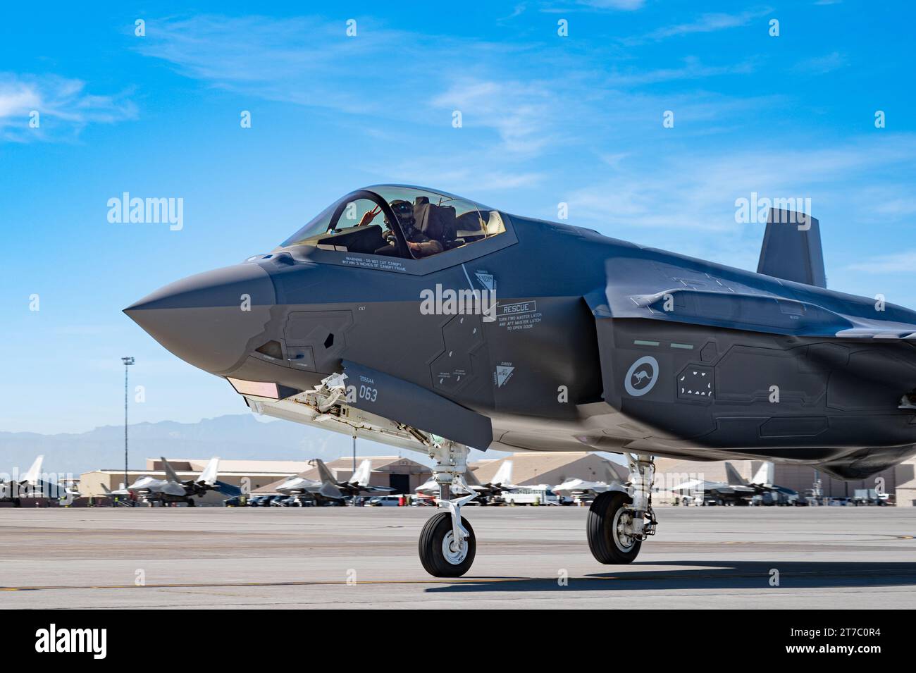 A Royal Australian Air Force (RAAF) pilot taxis down the runway at ...