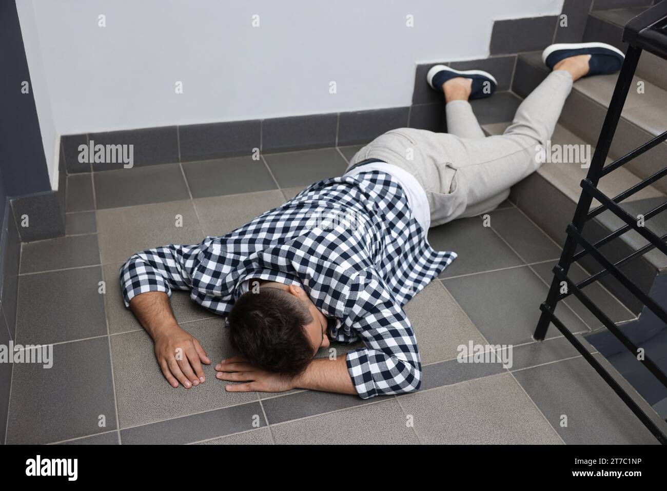 Unconscious man lying on staircase hi-res stock photography and images ...
