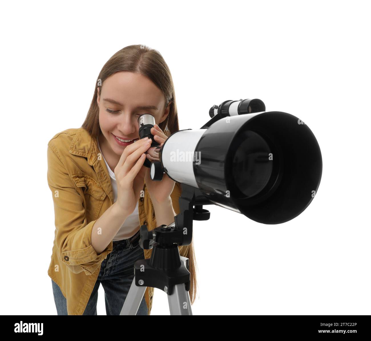 Young astronomer looking at stars through telescope on white background ...