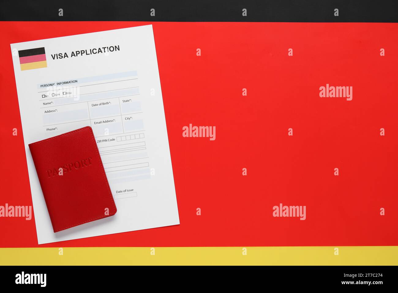 Immigration to Germany. Visa application form and passport on flag, top ...