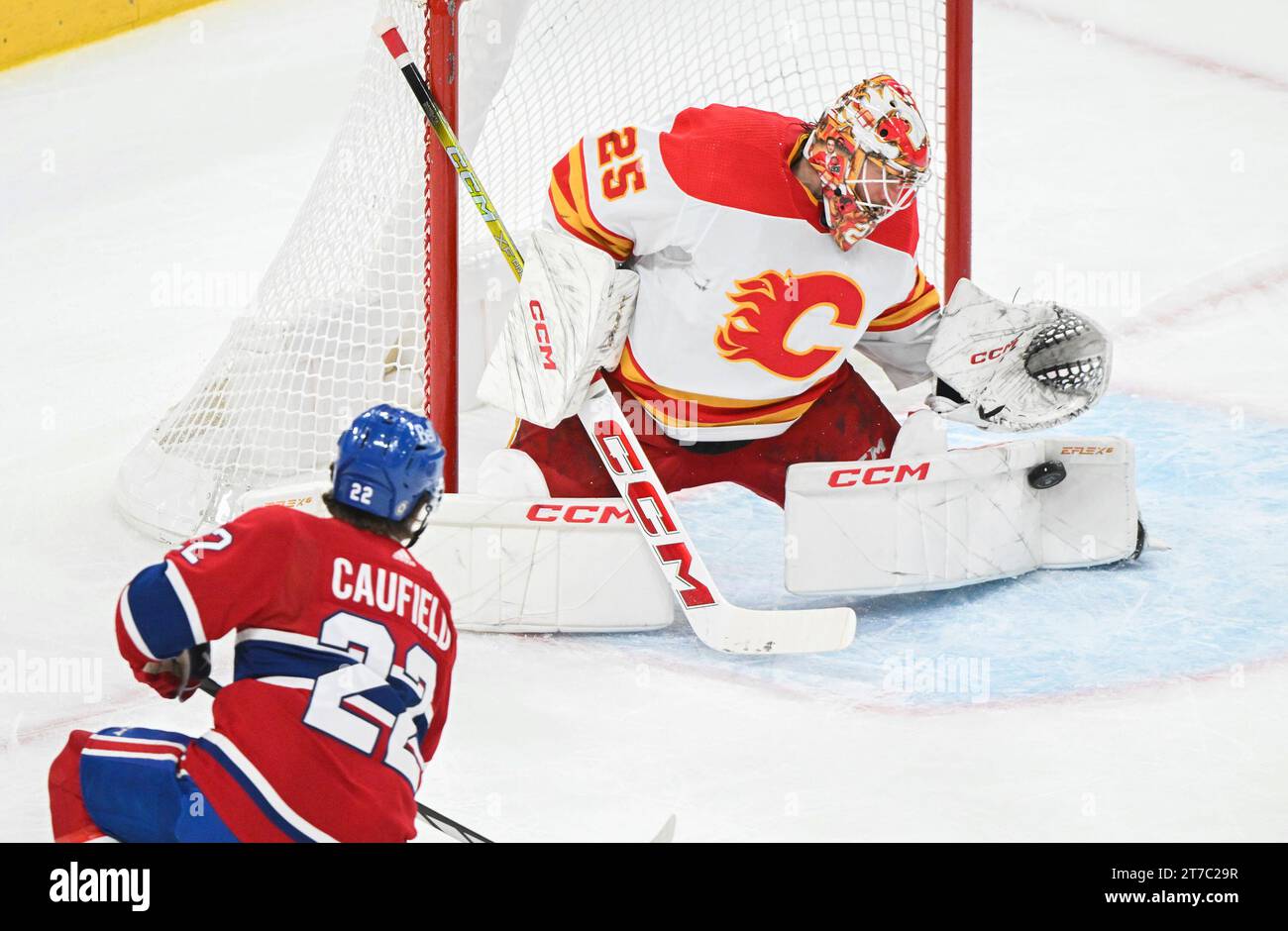 Calgary Flames goaltender Jacob Markstrom (25) stops a shot by Montreal Canadiens' Cole Caufield ...