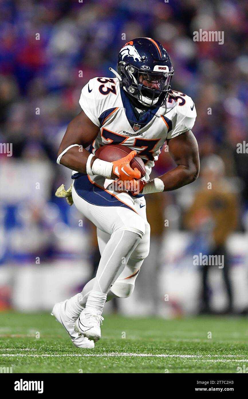 Denver Broncos running back Javonte Williams (33) runs with the ball ...