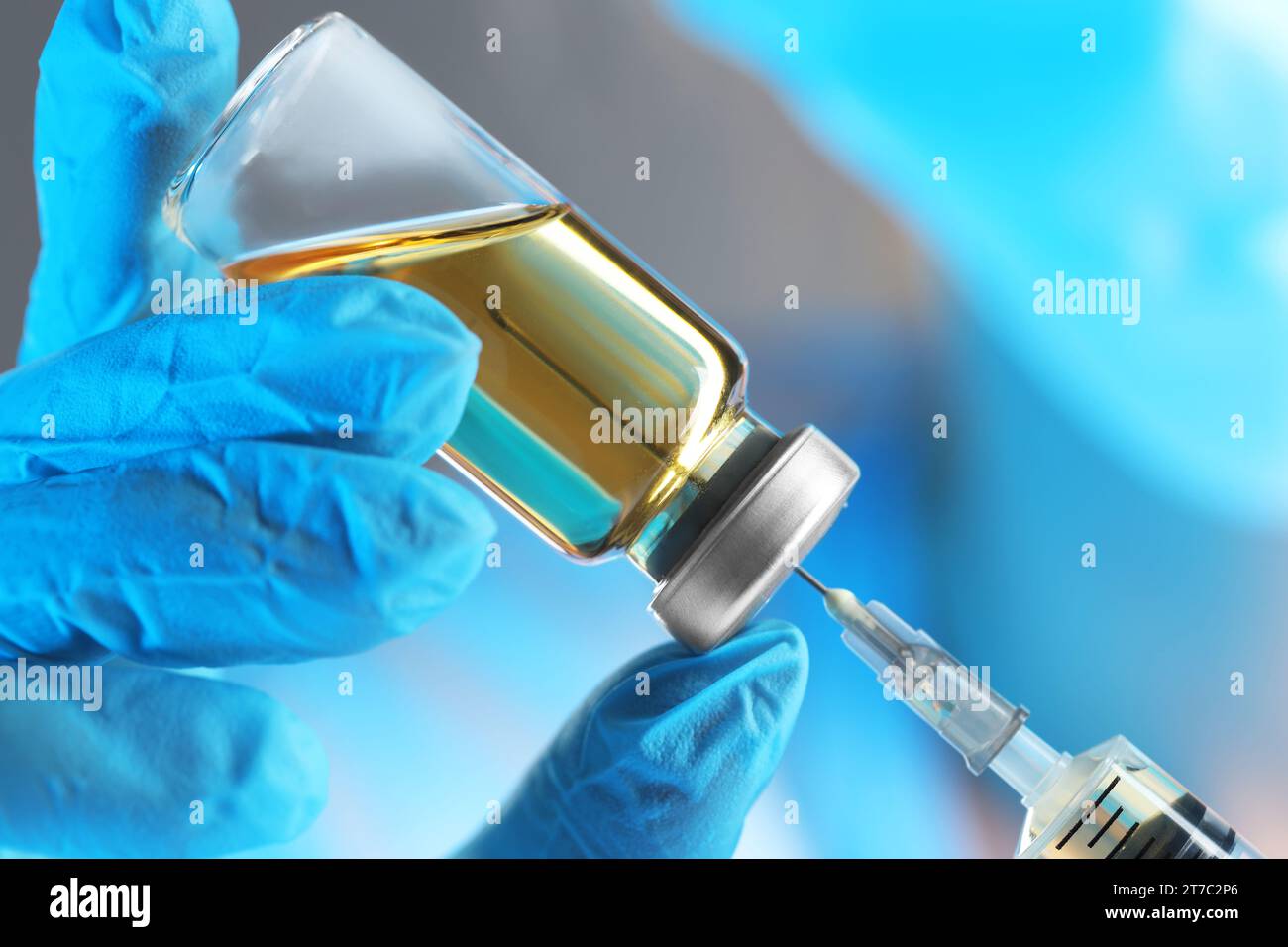 Doctor filling syringe with medication from glass vial, closeup Stock ...