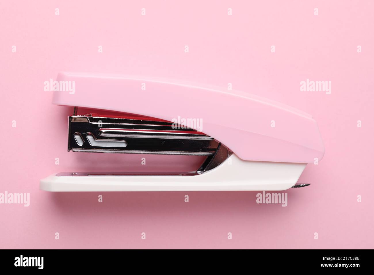 One new stapler on pink background, top view Stock Photo - Alamy