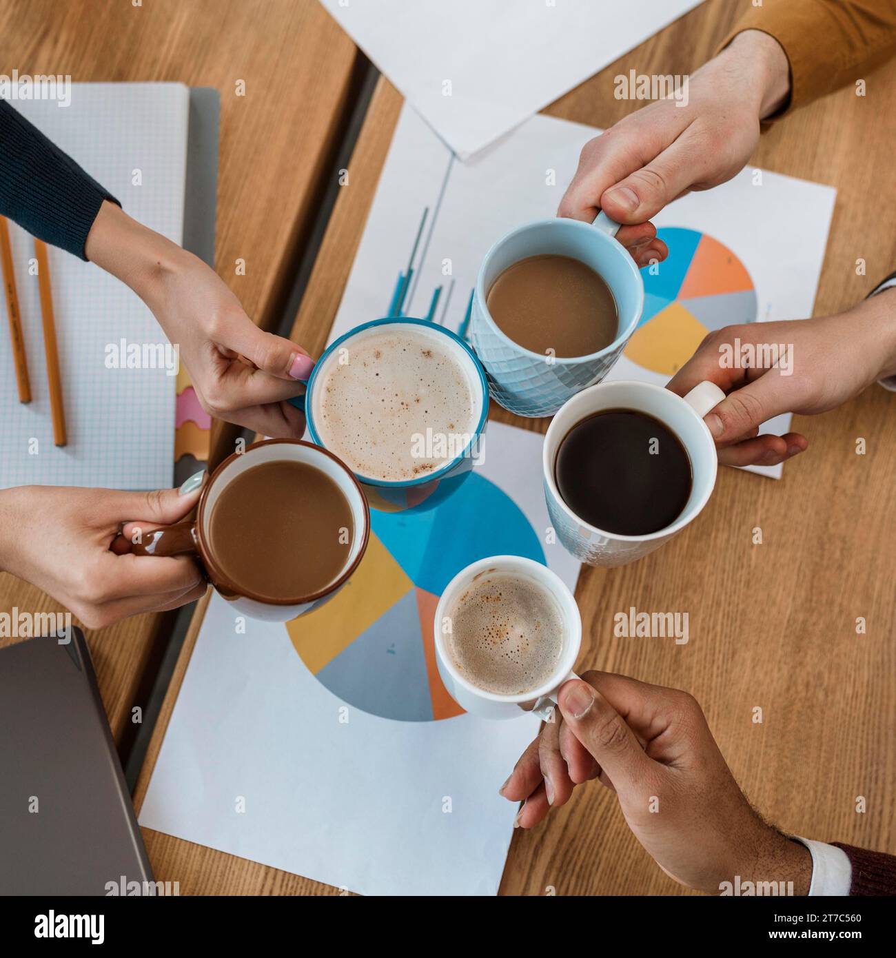 Top view people cheering with coffee mugs during office meeting Stock ...