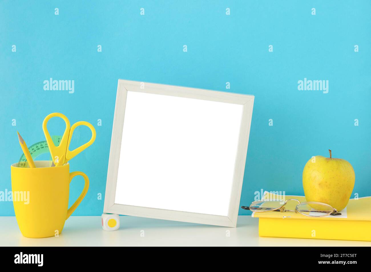 Workplace studies blue yellow colors with gray frame Stock Photo - Alamy