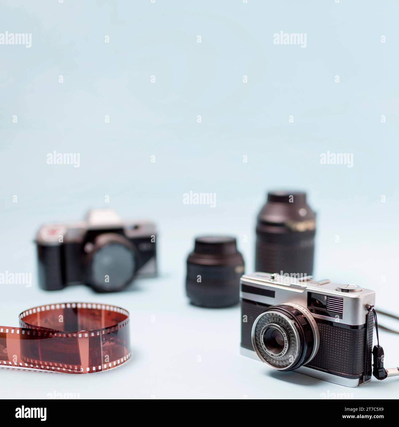 Camera optical lens rolled up film stripe blue background Stock Photo ...