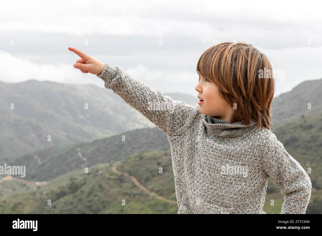 Boy pointing out Stock Photo - Alamy