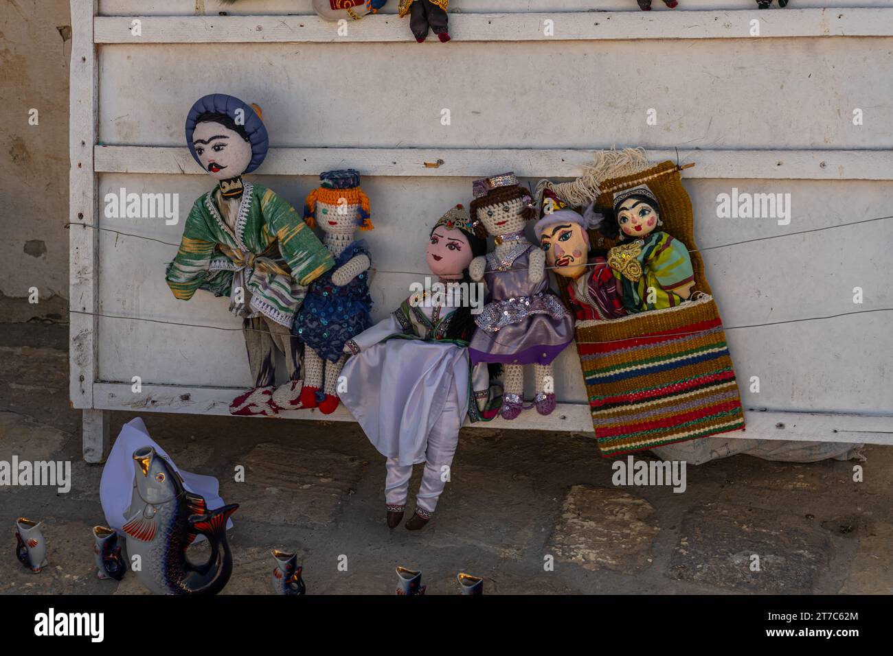 Dolls dressed in traditional uzbek costumes. Traditional souvenir ...