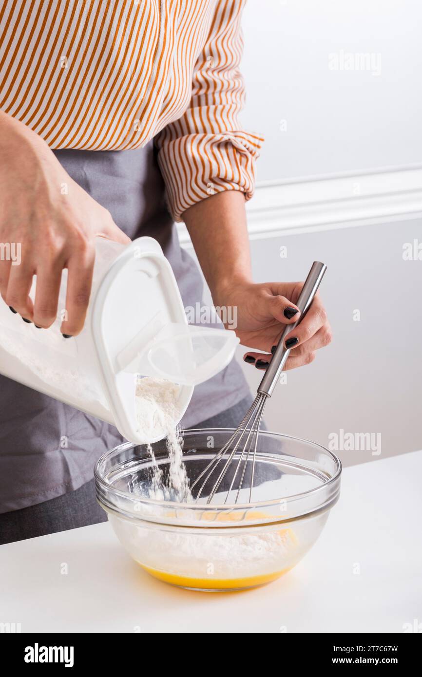 Female hand adding raw hi-res stock photography and images - Alamy